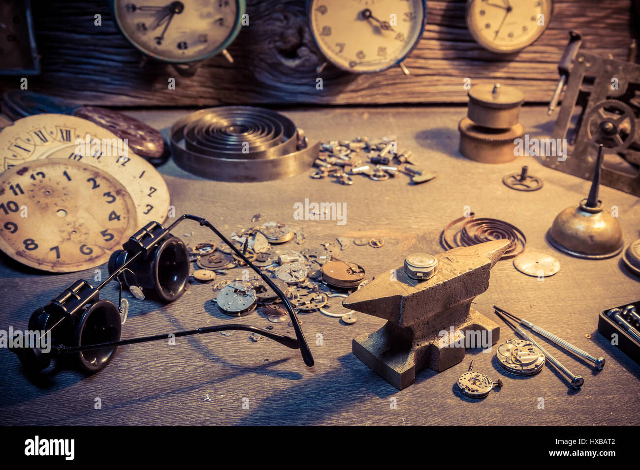 Old watchmaker's workshop with parts of clocks Stock Photo - Alamy