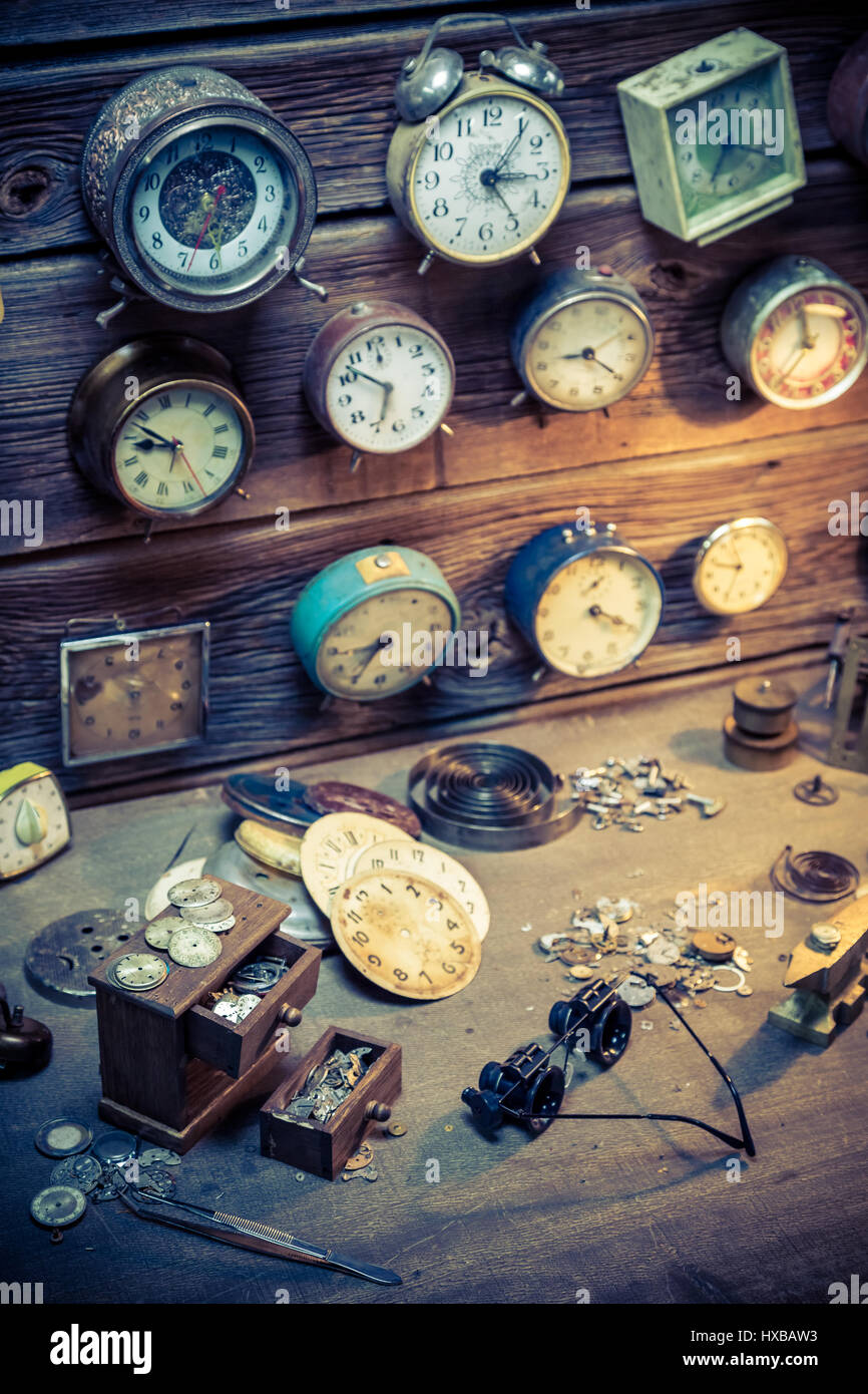Vintage watchmaker's workshop with parts of clocks Stock Photo - Alamy