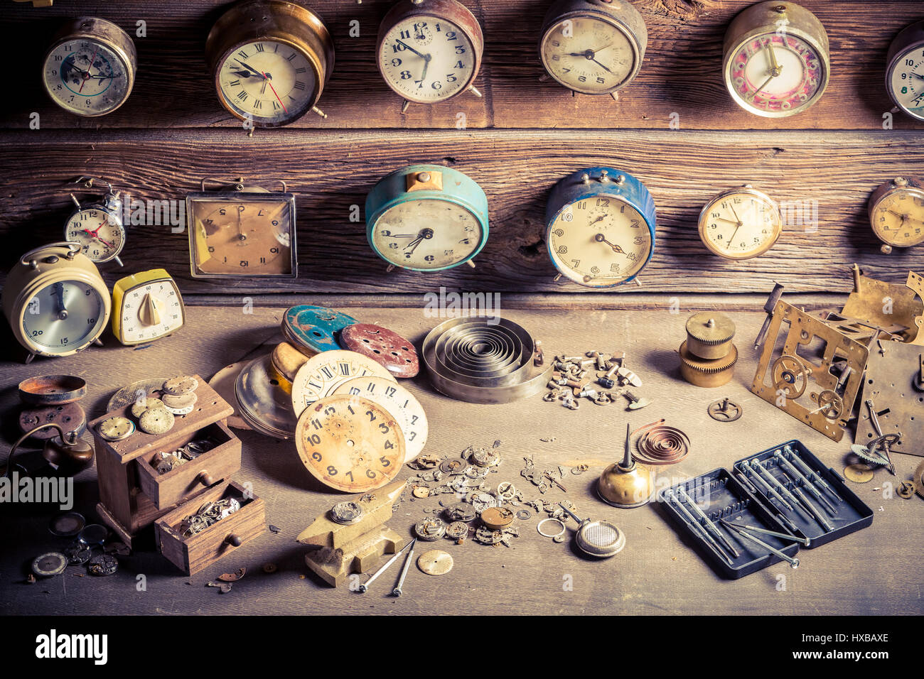 Small watchmaker's workshop with clocks to repair Stock Photo - Alamy