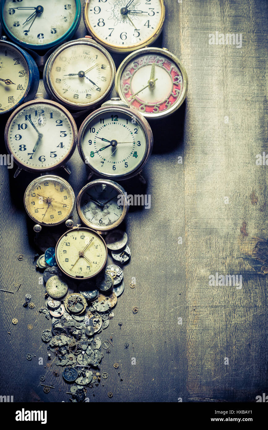Aged clocks and the parts Stock Photo - Alamy