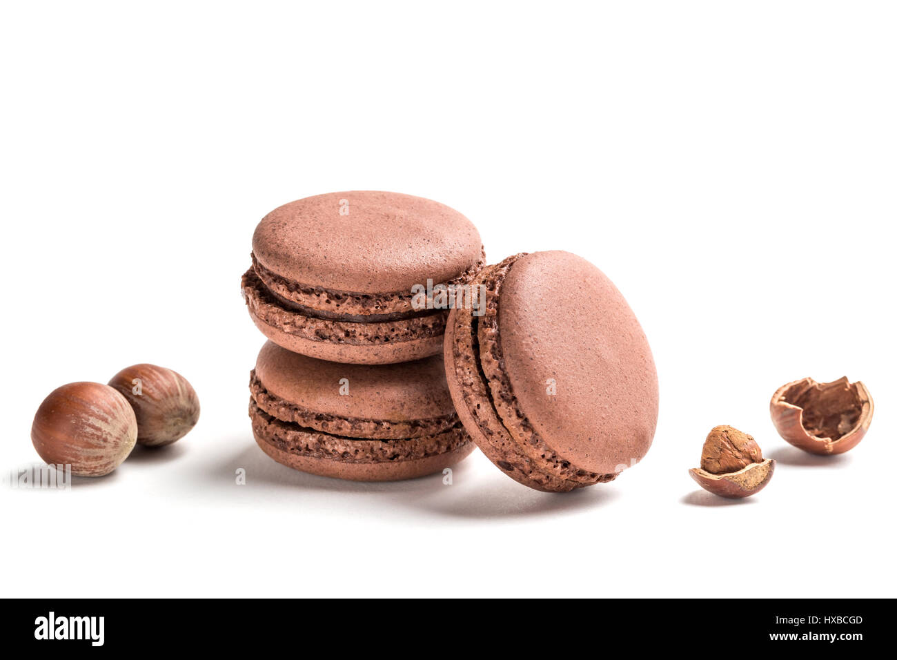 Sweet macaroons with nut on white background Stock Photo - Alamy