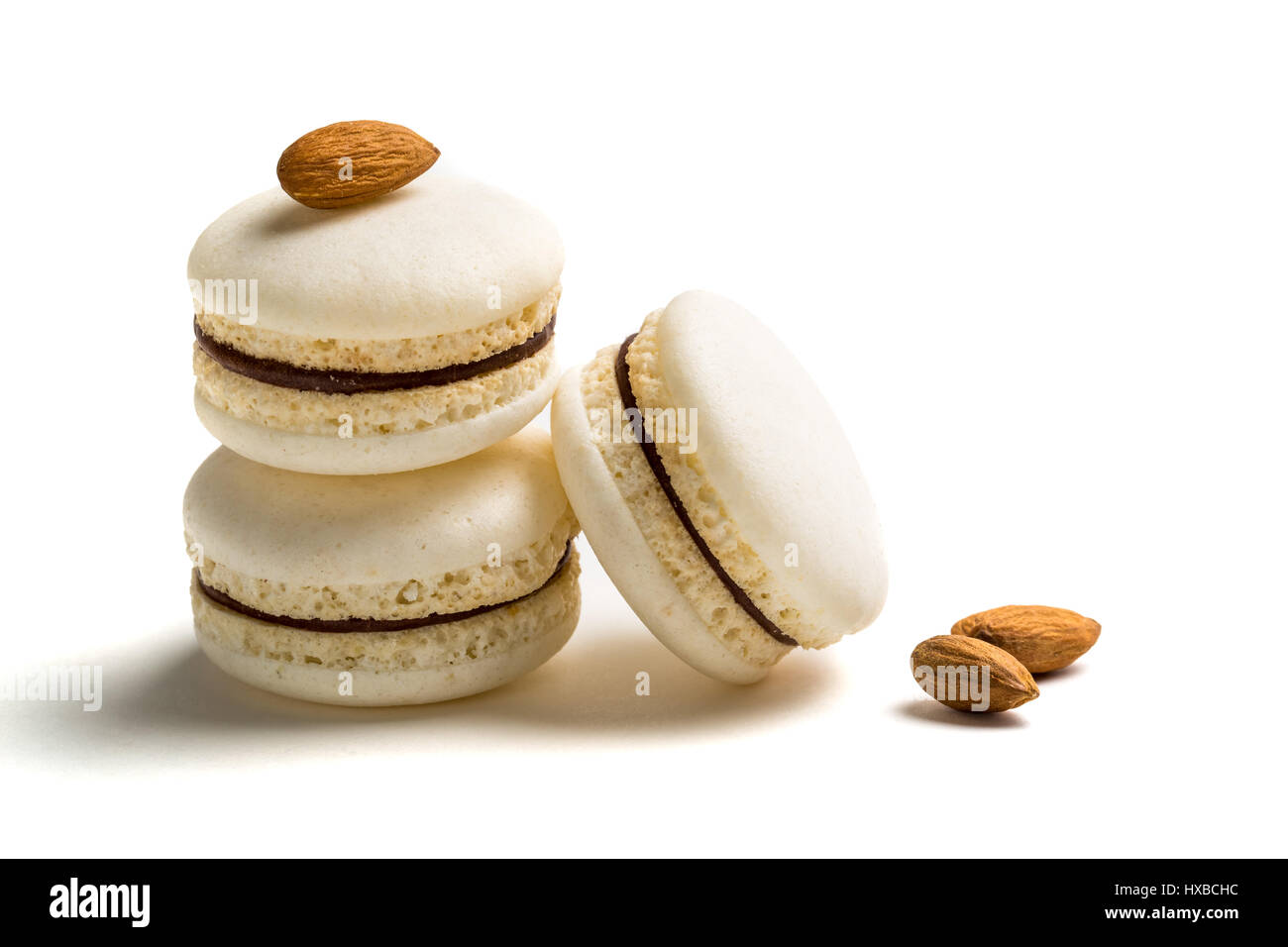 Small macaroons with almond on white background Stock Photo - Alamy