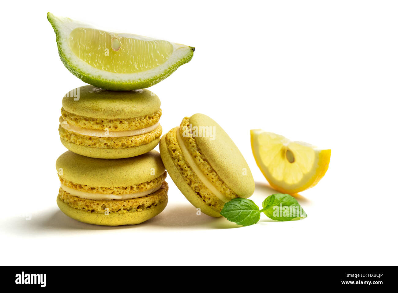Small macaroons with lemon on white background Stock Photo - Alamy