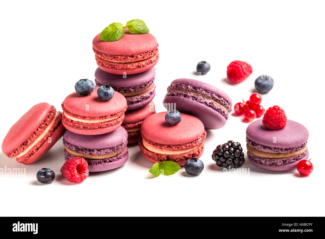 Fresh macaroons with fruits on white background Stock Photo - Alamy