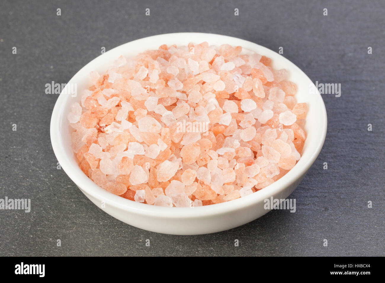 Himalayan sea salt on grey slate base Stock Photo - Alamy