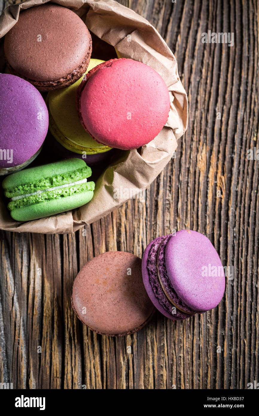 Tasty macaroons in paper bag Stock Photo - Alamy