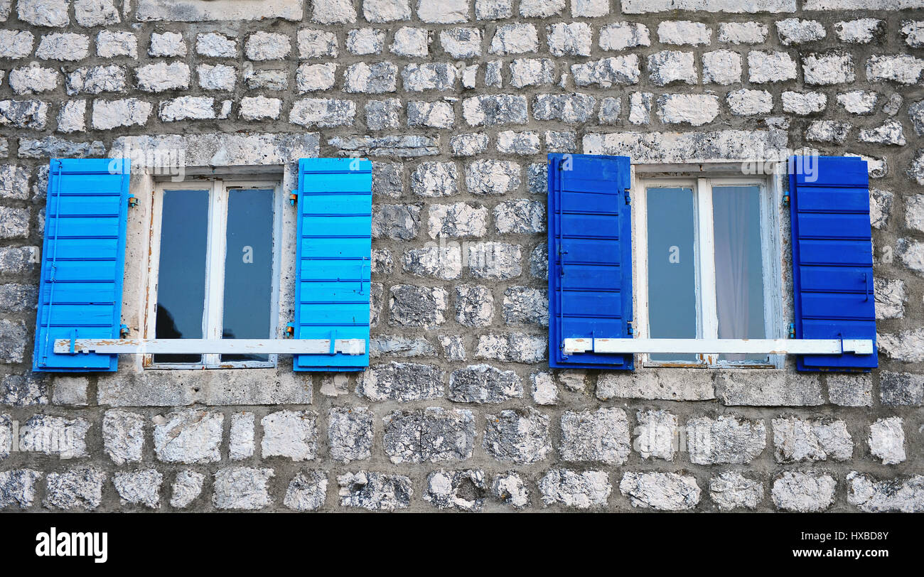 Windows frames with blue blinds in the stone house Stock Photo - Alamy