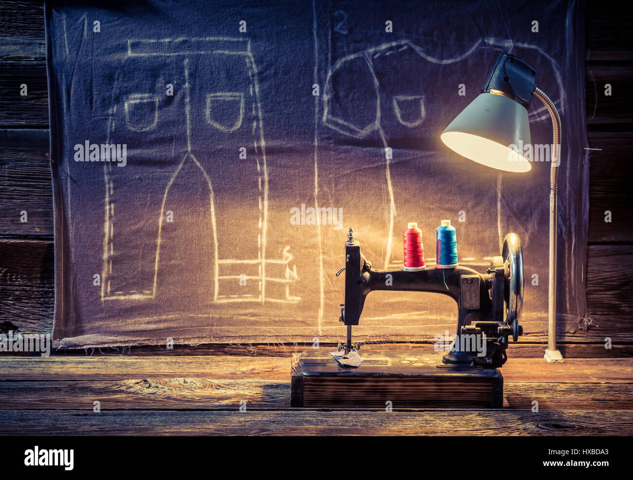 Tailor workshop with sewing machine and cloth Stock Photo - Alamy