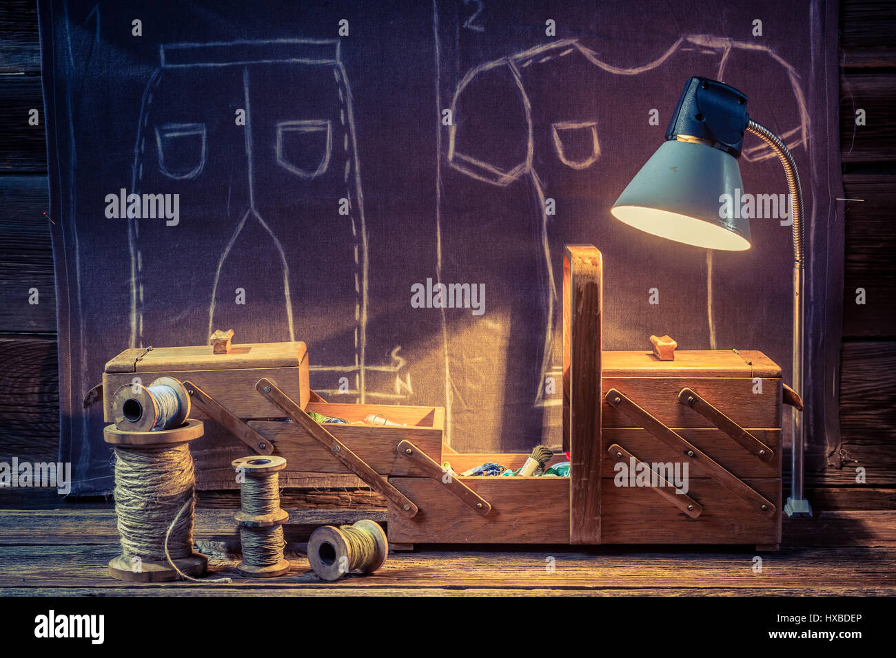 Old tailor workshop with needles, threads and materials Stock Photo - Alamy