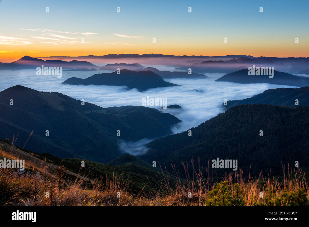 Spring mountain landscape with clouds inversion Stock Photo - Alamy
