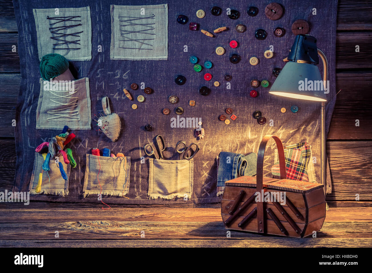Sewing cloth made of buttons, needles and threads in tailor workshop ...