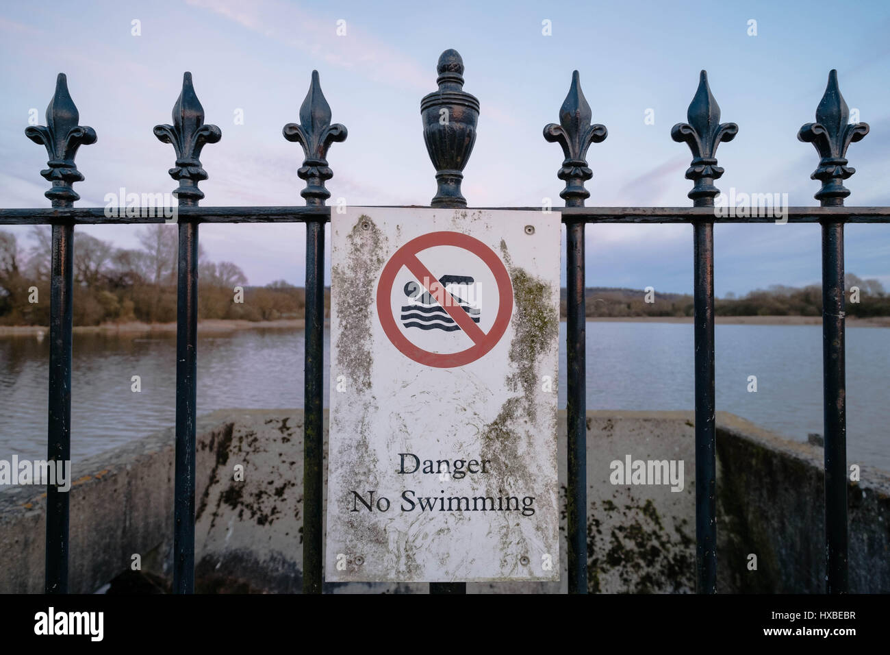 Colour photograph of a Danger No Swimming hazard warning sign at an ...