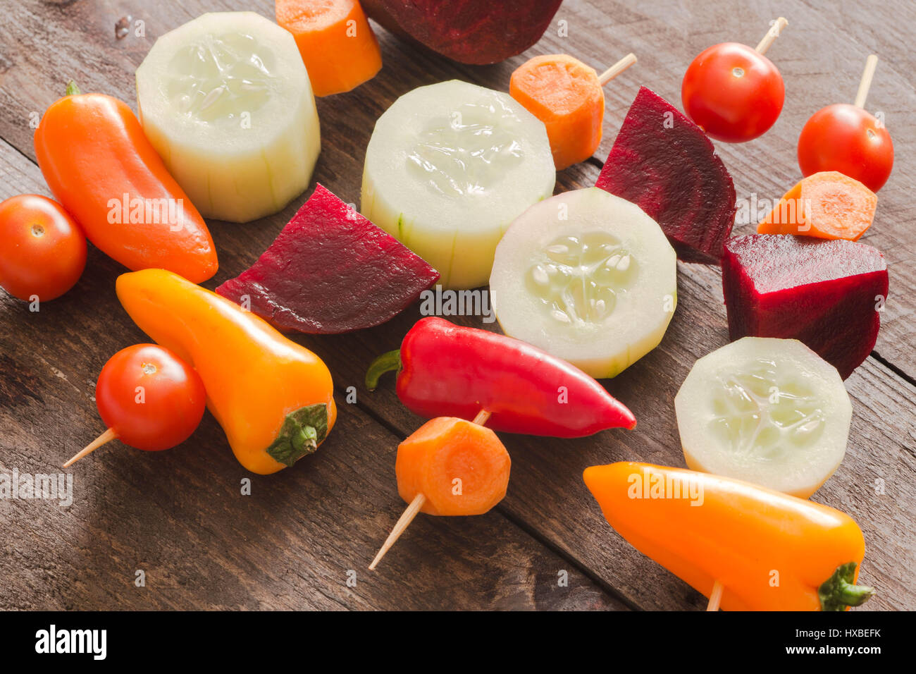 vegetables skewers on the wooden background / the concept of healthy ...