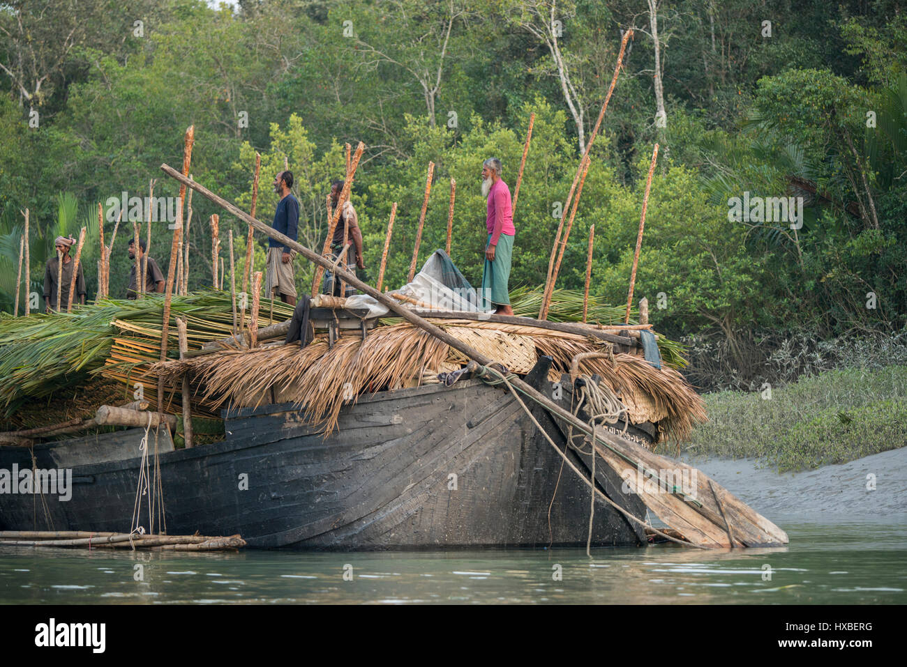 Bangladesh, The Sundarbans National Park. Traditional wooden boat along ...