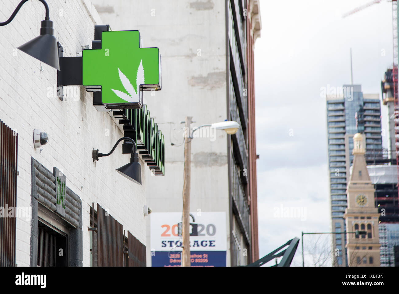 A medical green cross marijuana sign on the exterior of a dispensary in ...