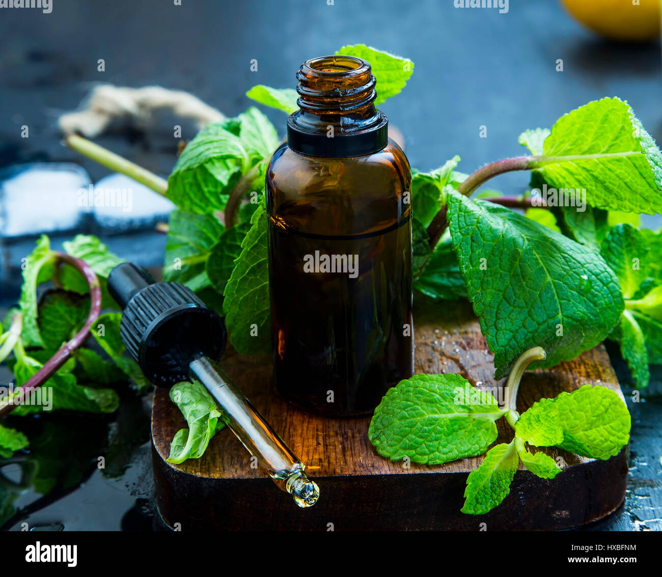 Essential mint oil in brown glass bottle with dropper, herbal medicine ...