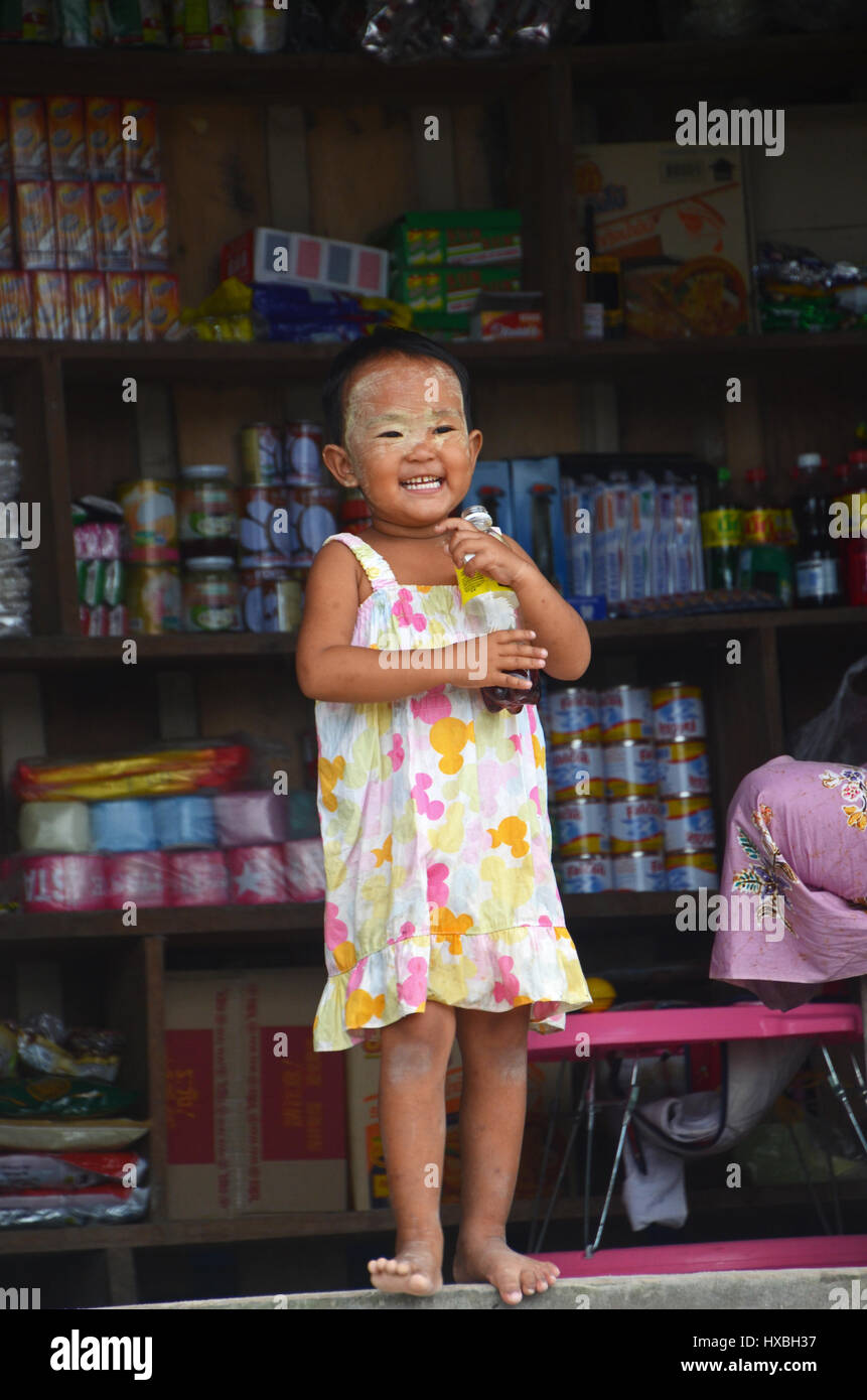 Young girl outside a shop in the village of Makyone Galet, Lampi ...