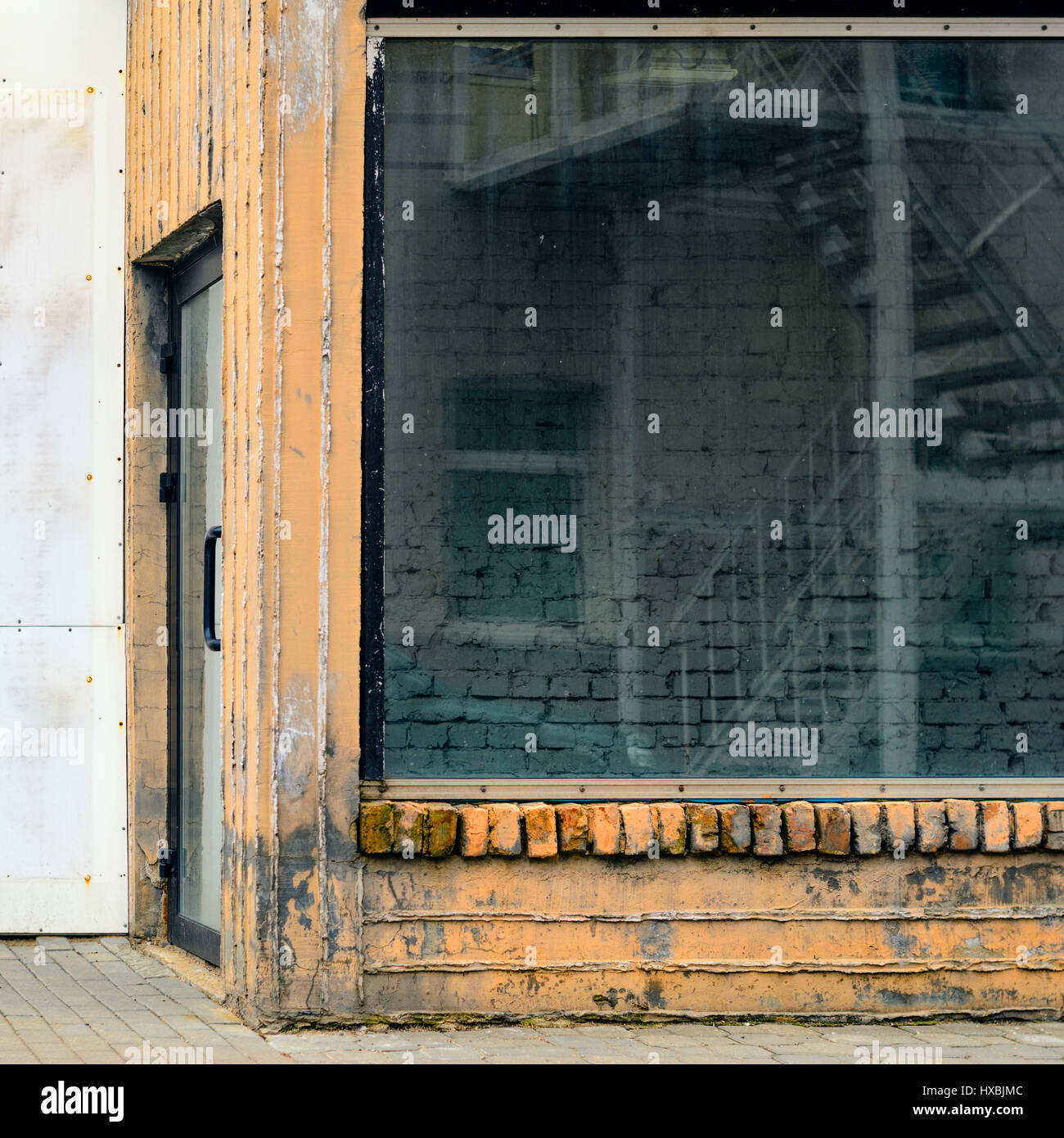 Abandoned storefront. Empty old showcase. Building entry Stock Photo ...