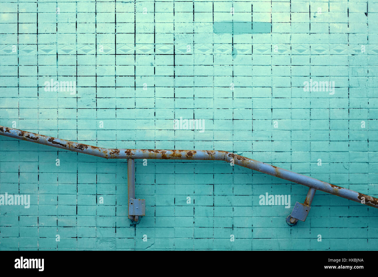 Painted Tile Wall Texture with Metal Railing for Background or Copy ...