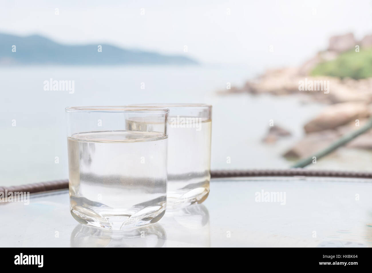Glass of water at outdoor restaurant Stock Photo - Alamy