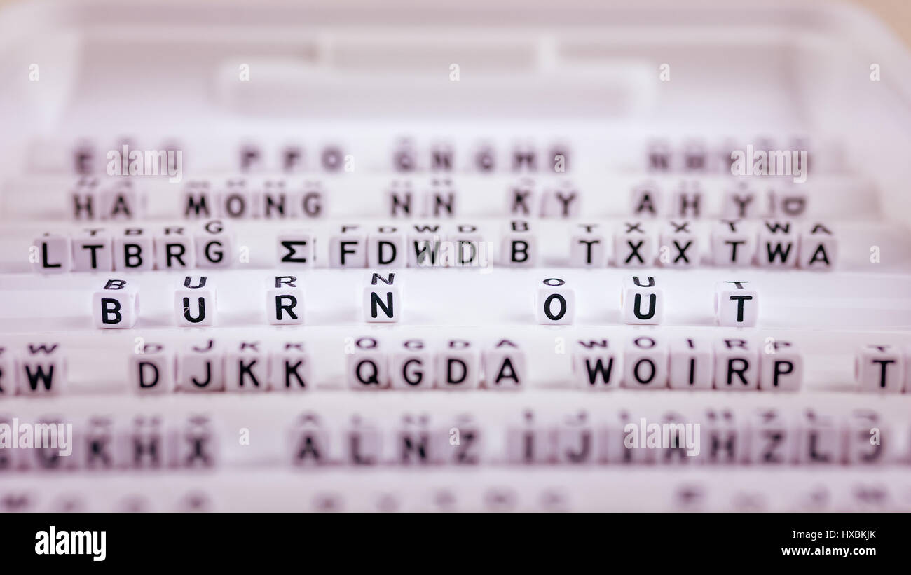 Burn out letters in focus between other blurred lettters Stock Photo ...