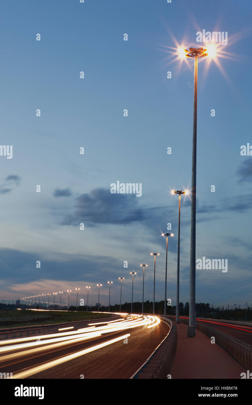 Lighting columns on the highway, night lighting road, track at night ...