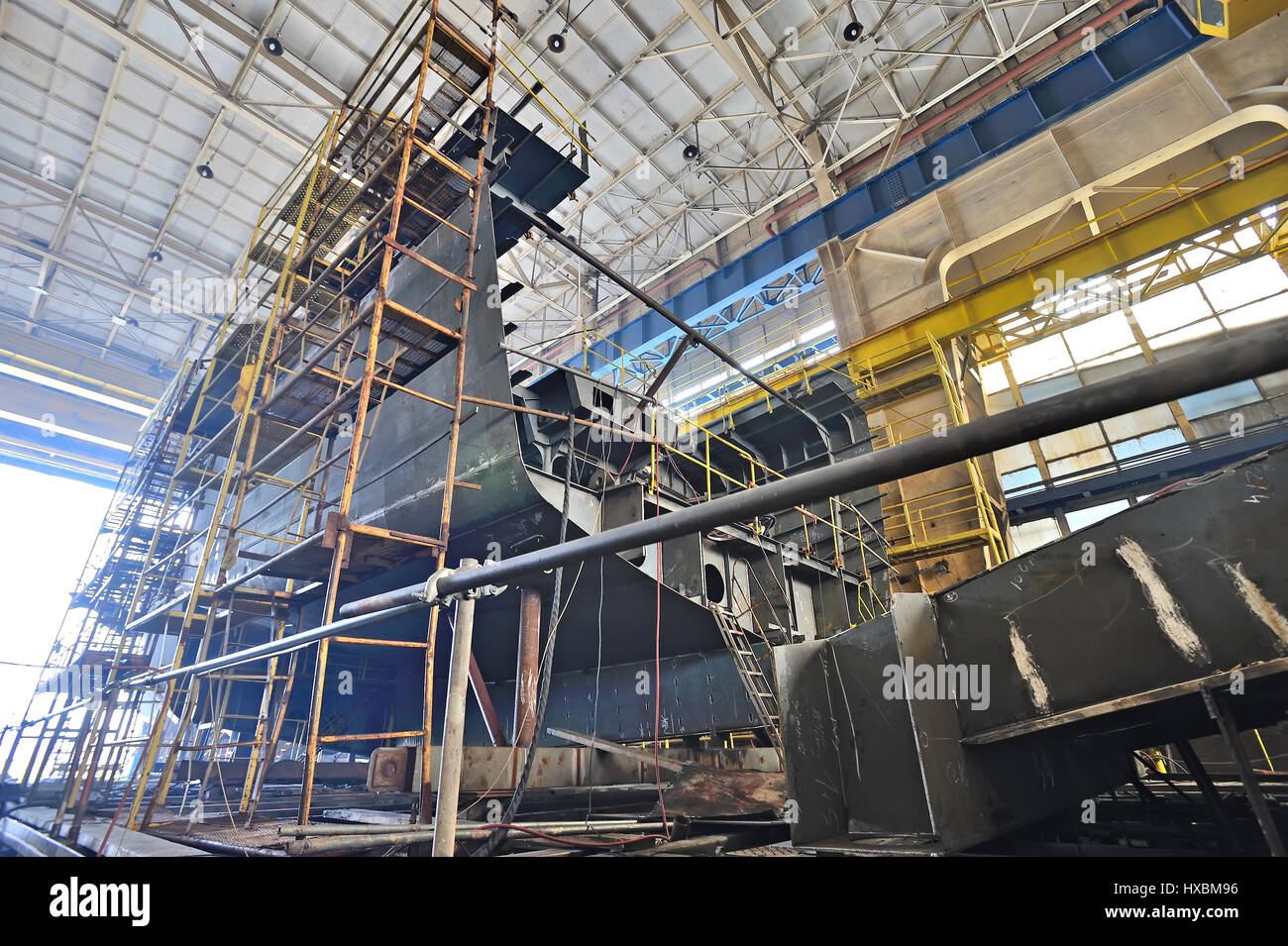 Industrial ship building inside of shipyard Stock Photo - Alamy