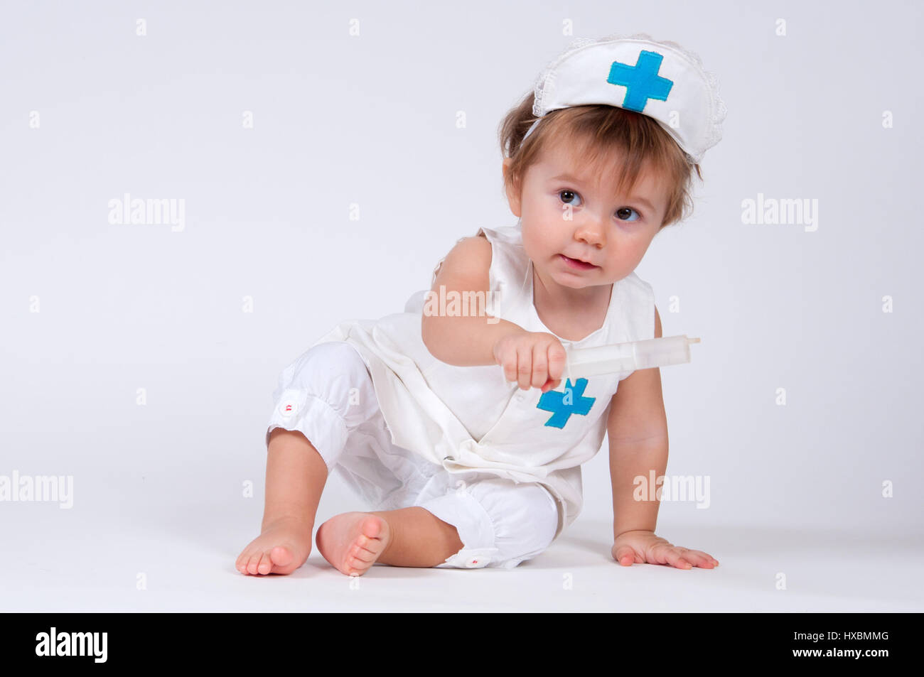 child playing as a doctor with syringe Stock Photo - Alamy