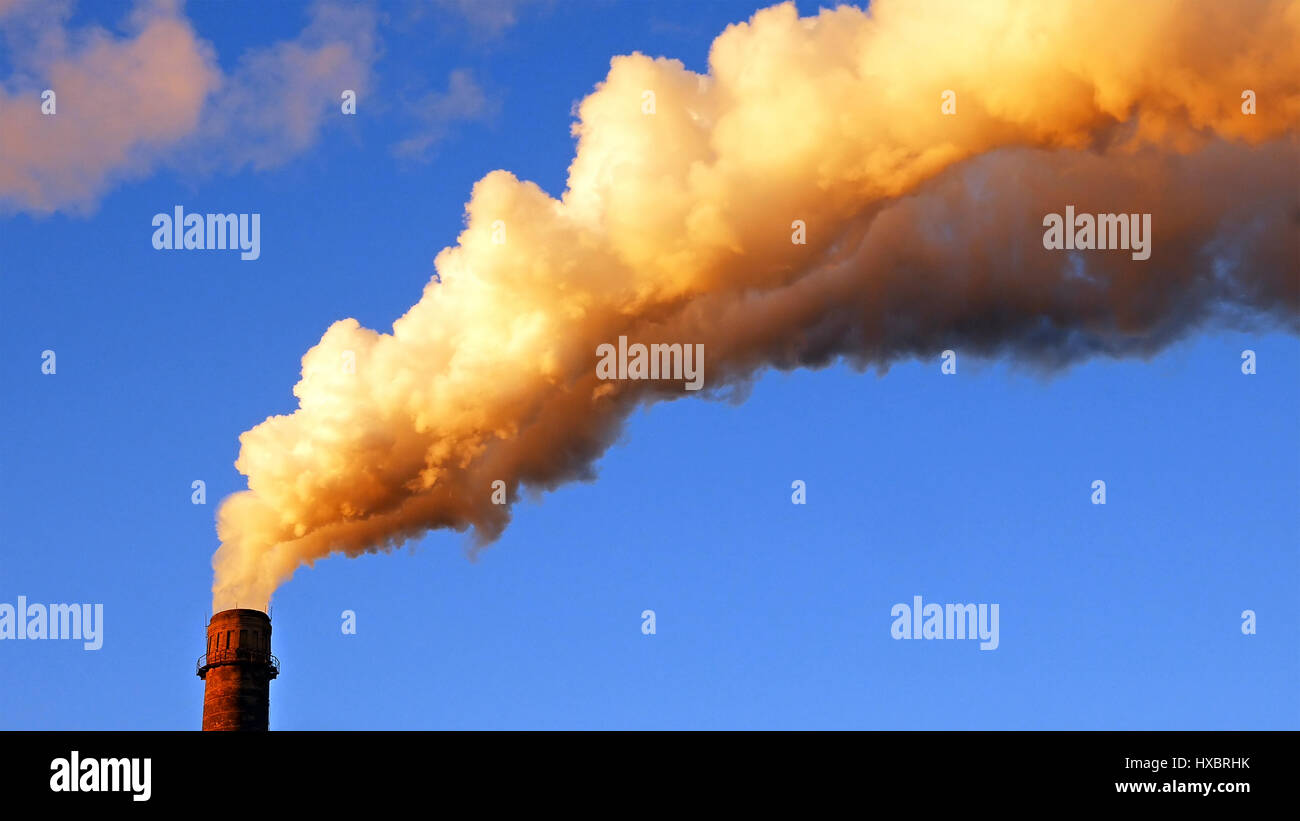 Factory plant smoke stack over blue sky background Stock Photo - Alamy