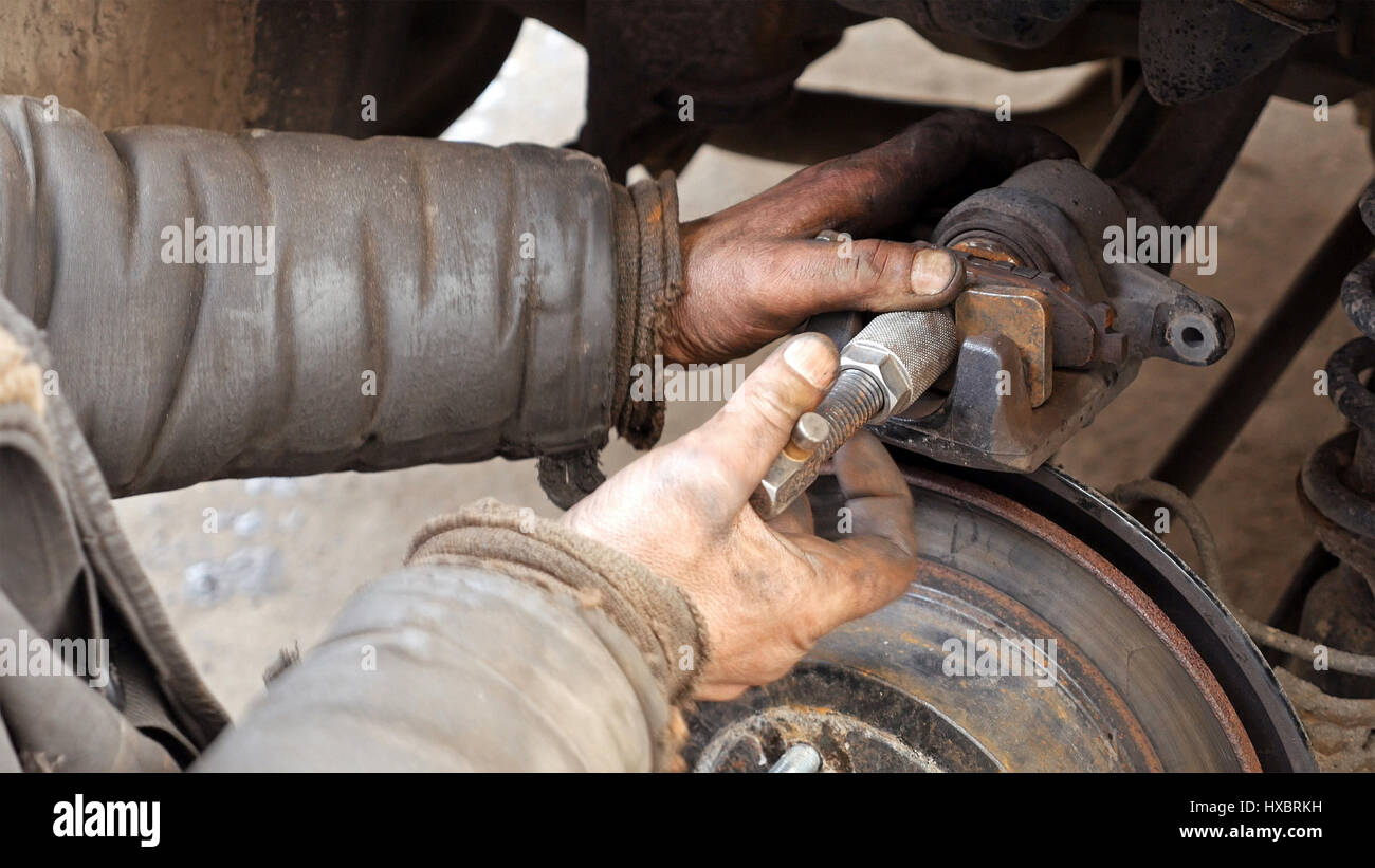 Auto mechanic working on brakes hi-res stock photography and images - Alamy