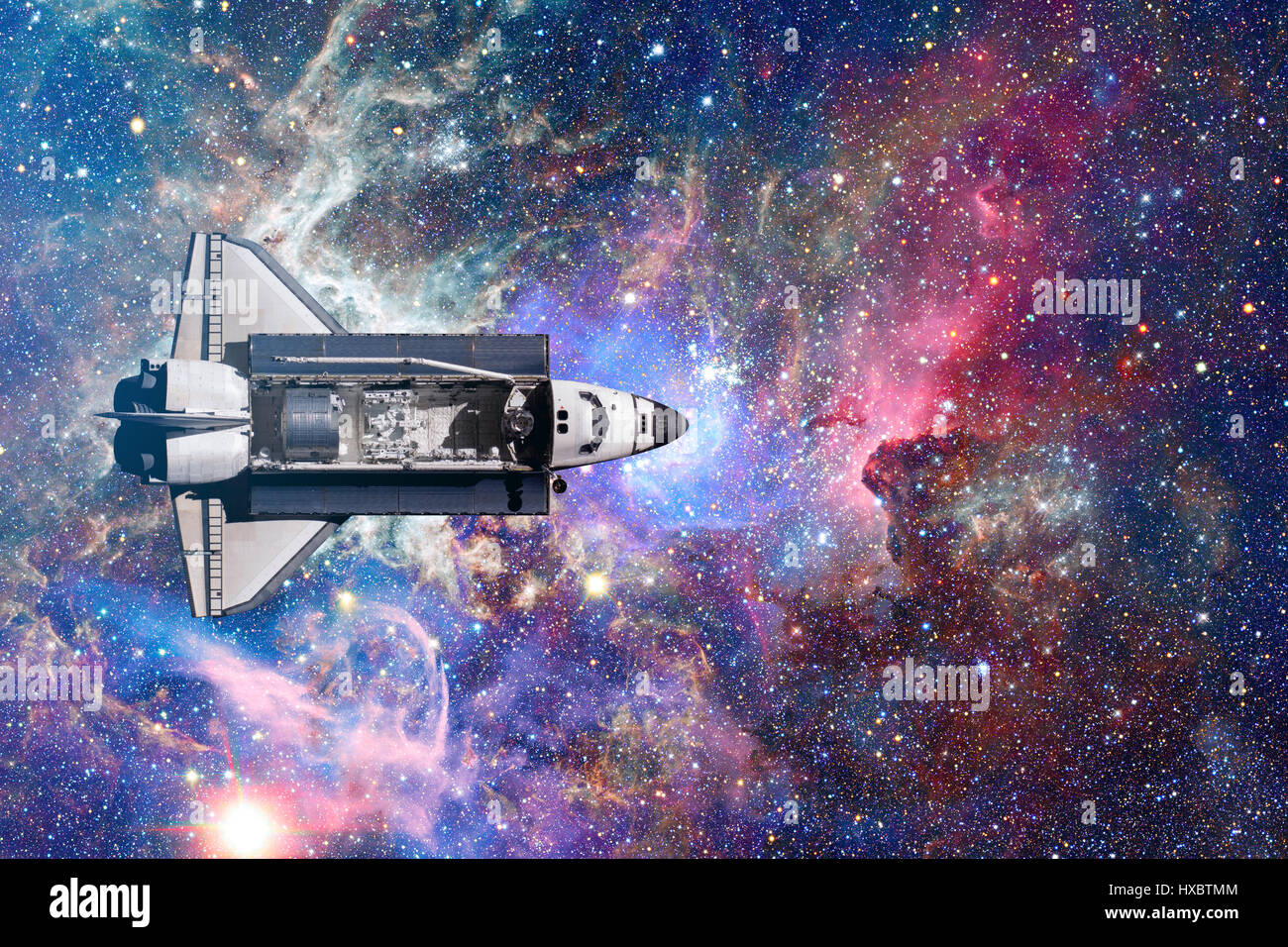 Space Shuttle flight over space nebula Stock Photo - Alamy