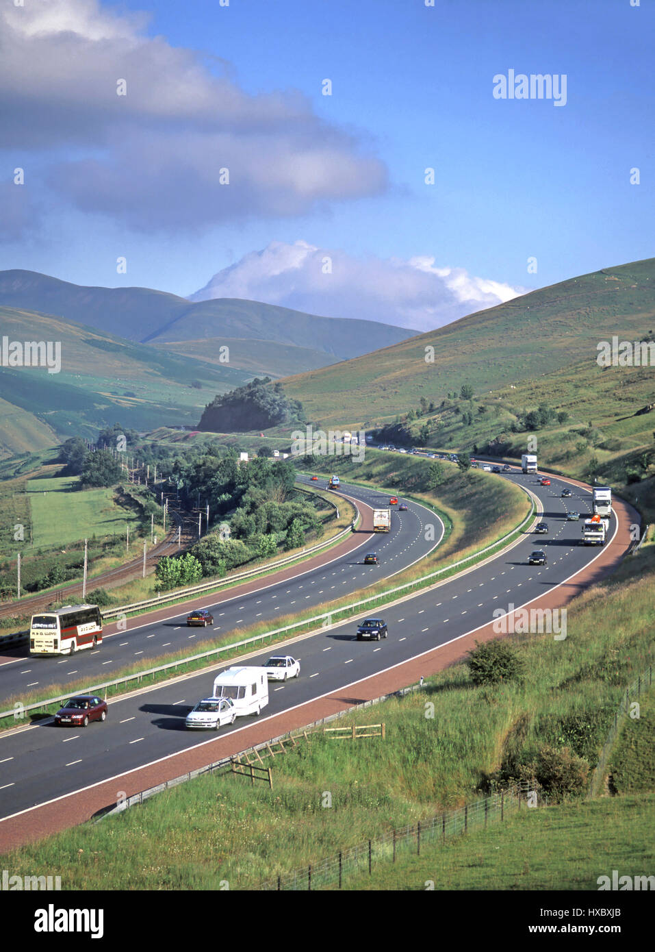M6 uk motorway traffic red hard shoulder scenic countryside landscape ...