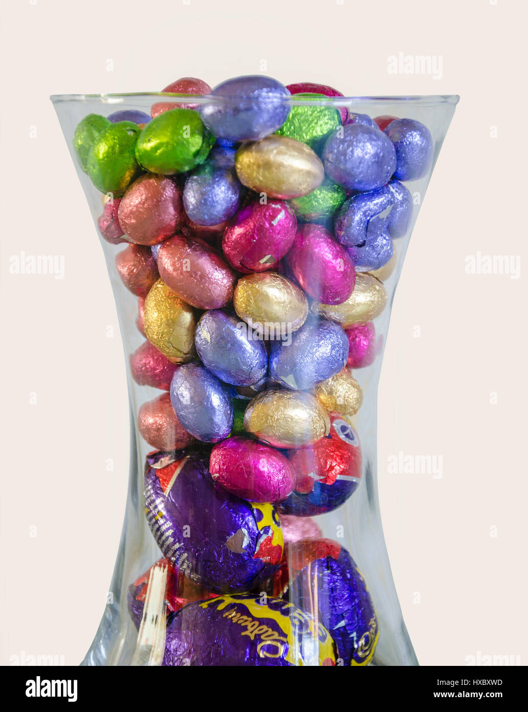 Mini chocolate Easter eggs wrapped in brightly coloured foil wrappings ...