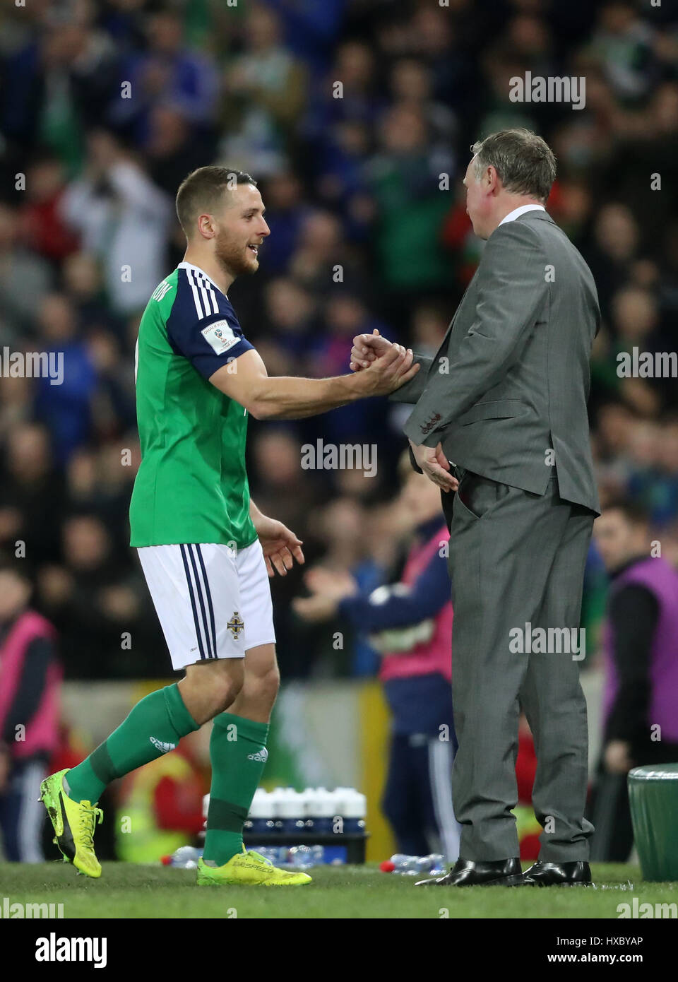 Northern Ireland's Conor Washington (left) shakes the hand of Northern ...