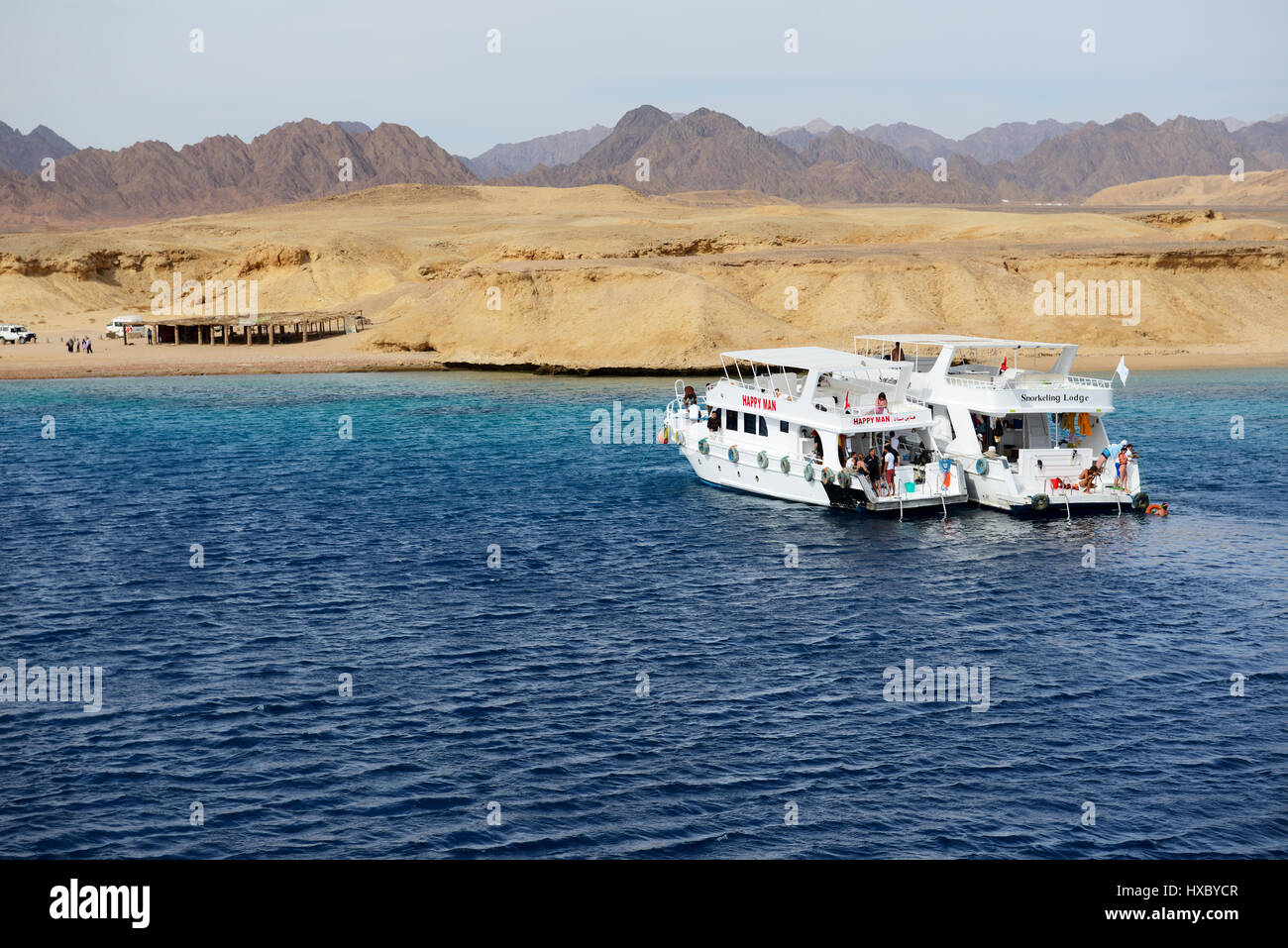 SHARM EL SHEIKH, EGYPT - DECEMBER 4: Snorkeling tourists and motor ...