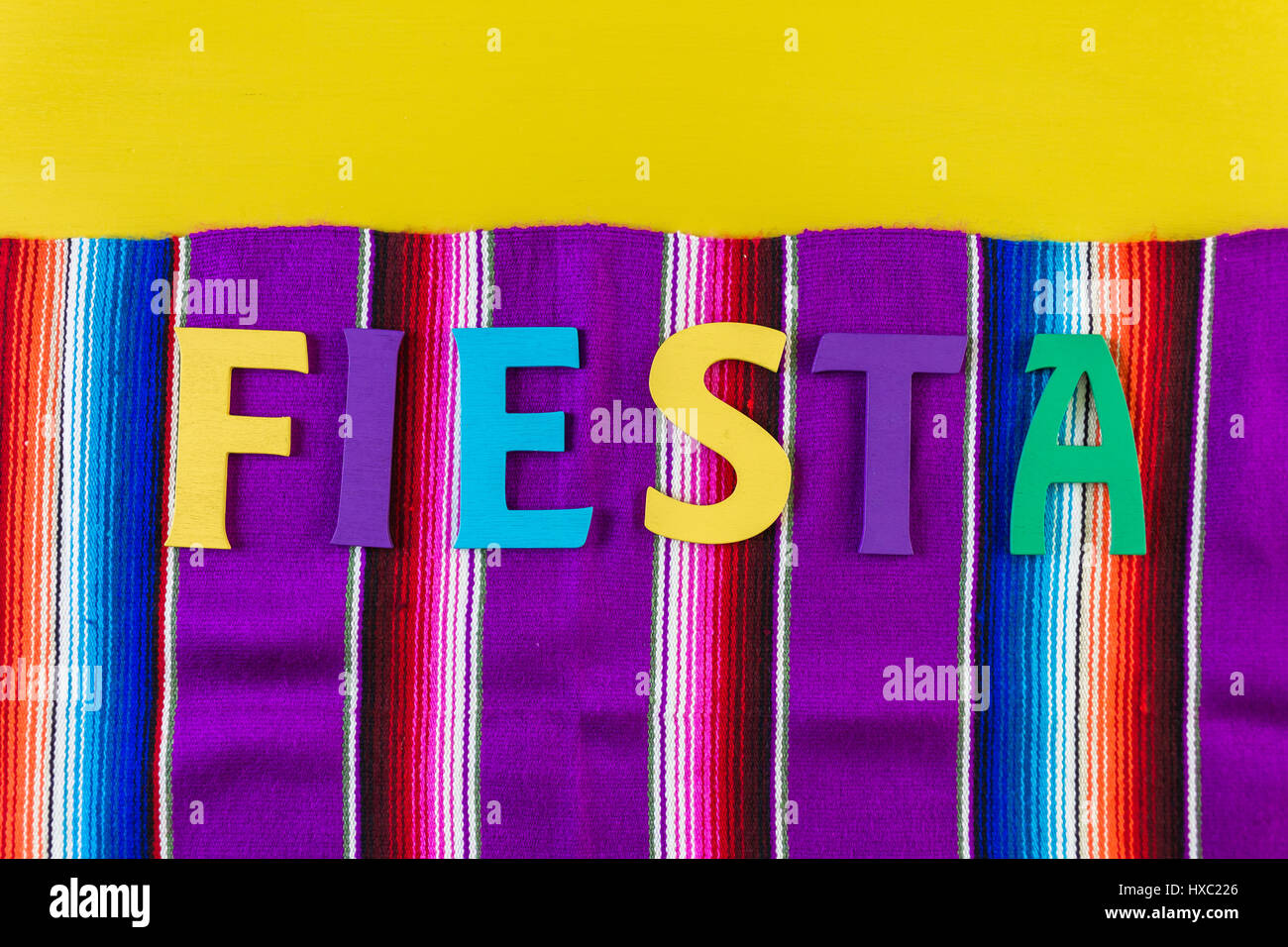 Word Fiesta on a bright painted wood background Stock Photo - Alamy