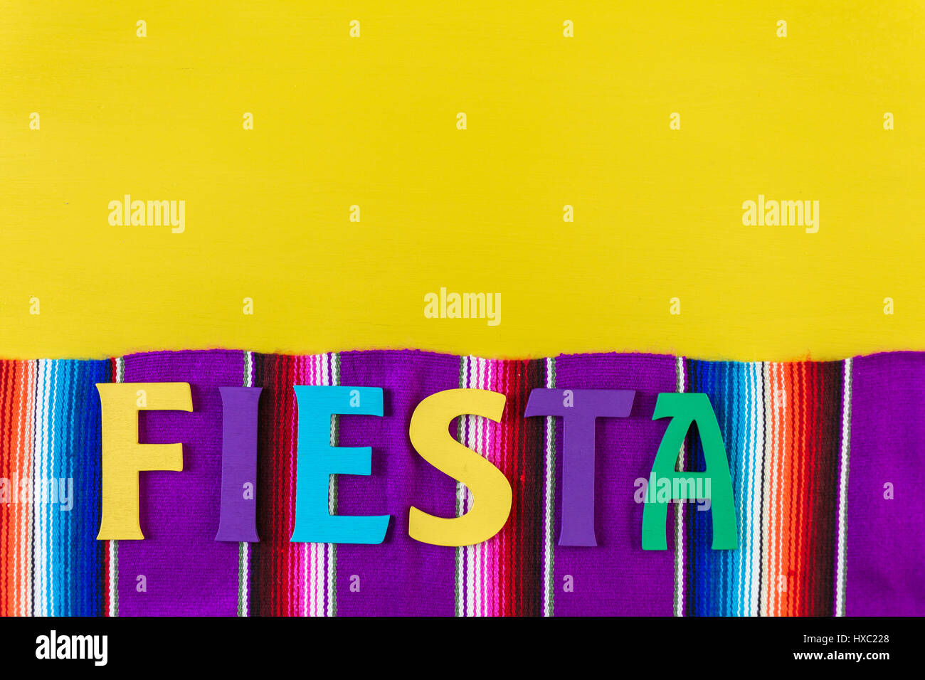 Word Fiesta on a bright painted wood background Stock Photo - Alamy