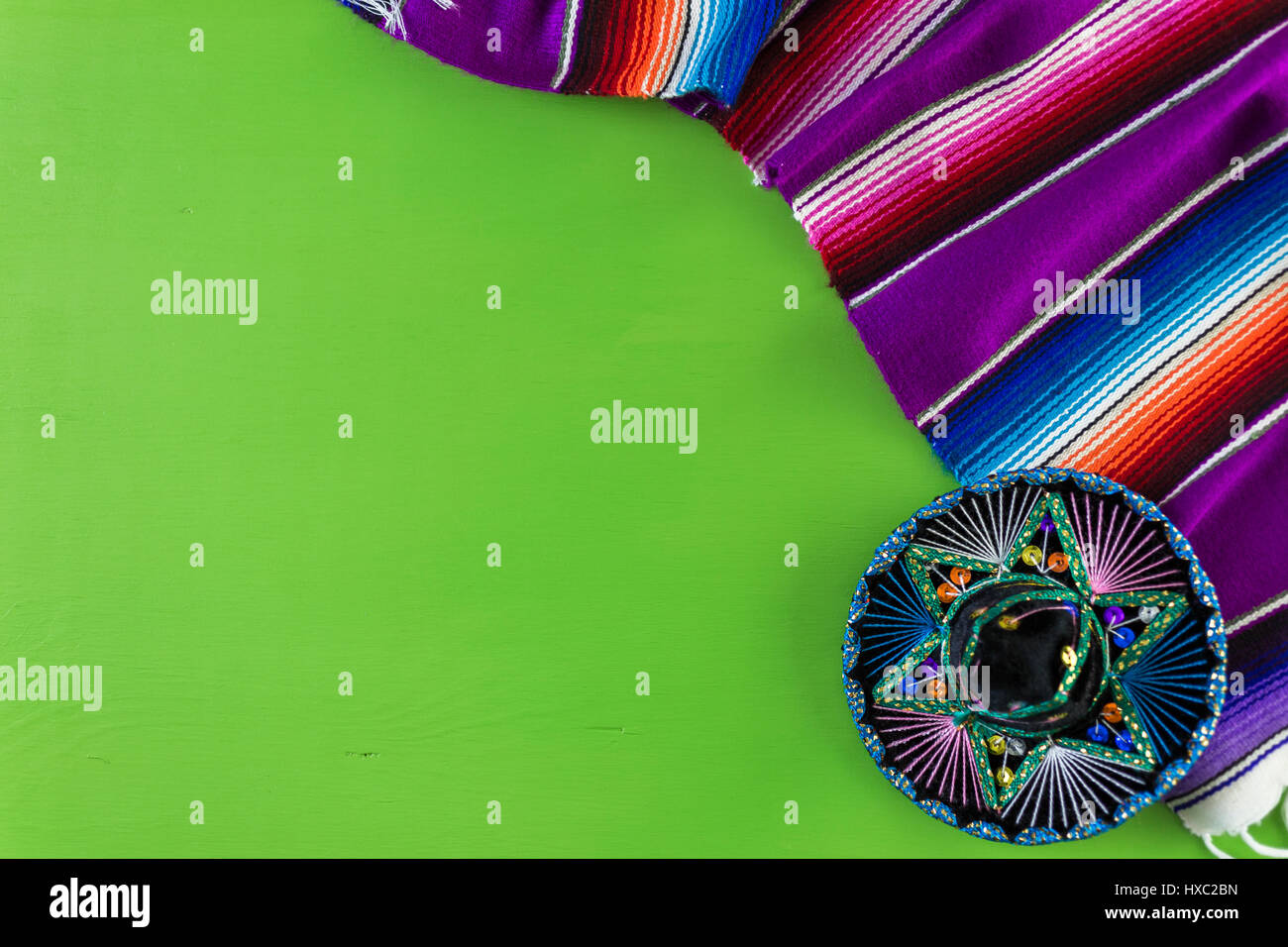 sarape blanket on a bright green background Stock Photo - Alamy