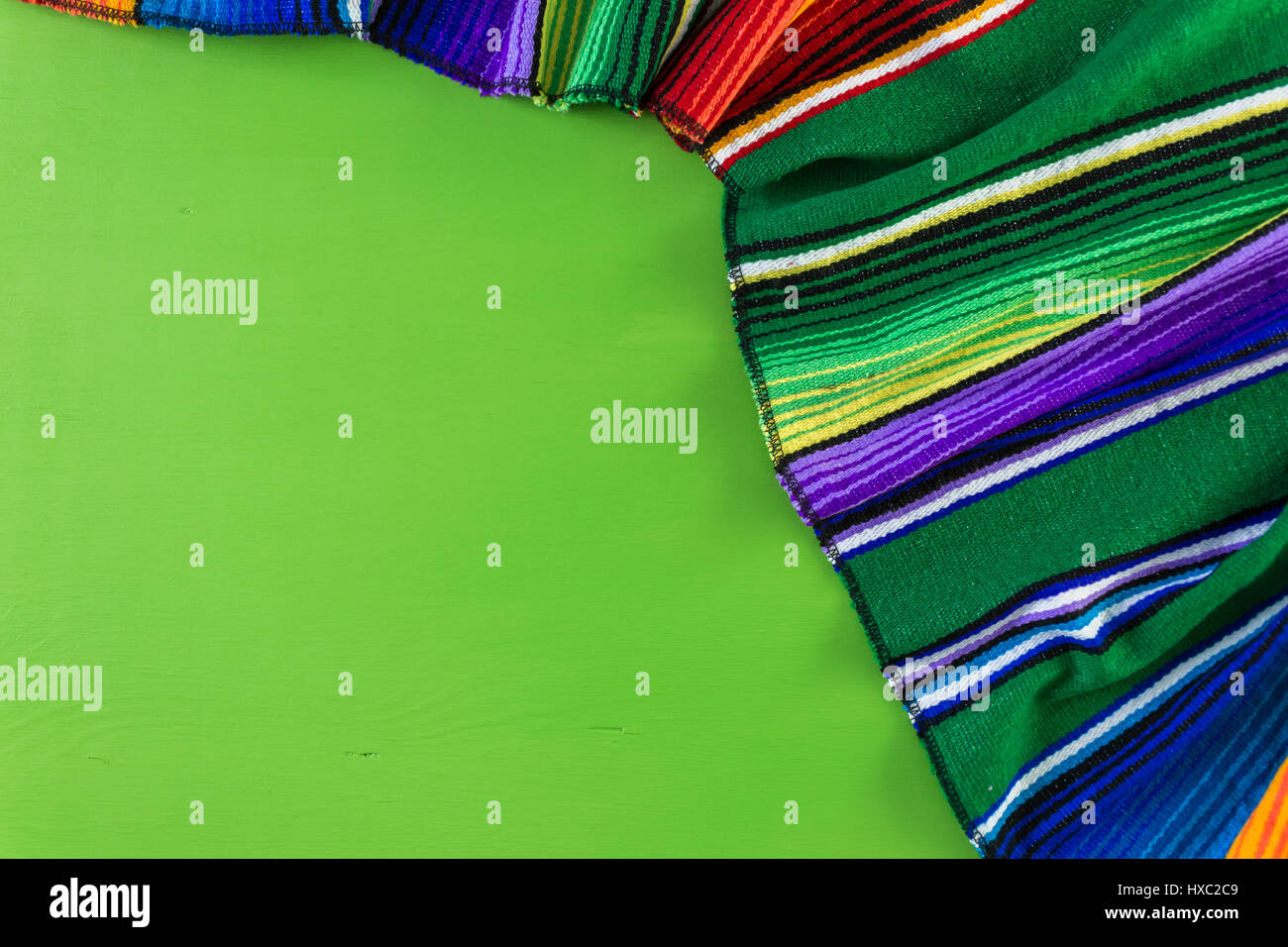 sarape blanket on a bright green background Stock Photo - Alamy