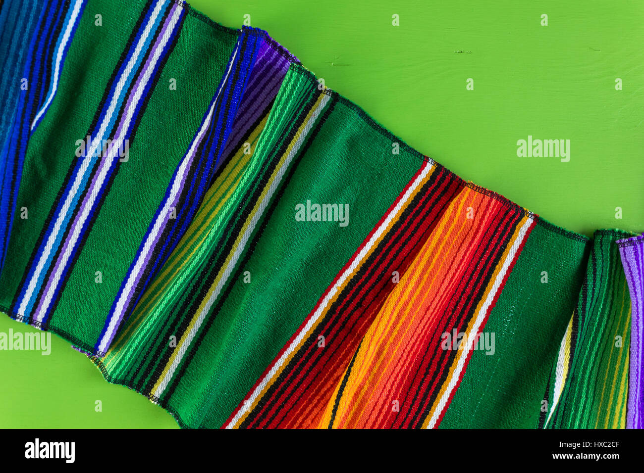 sarape blanket on a bright green background Stock Photo - Alamy