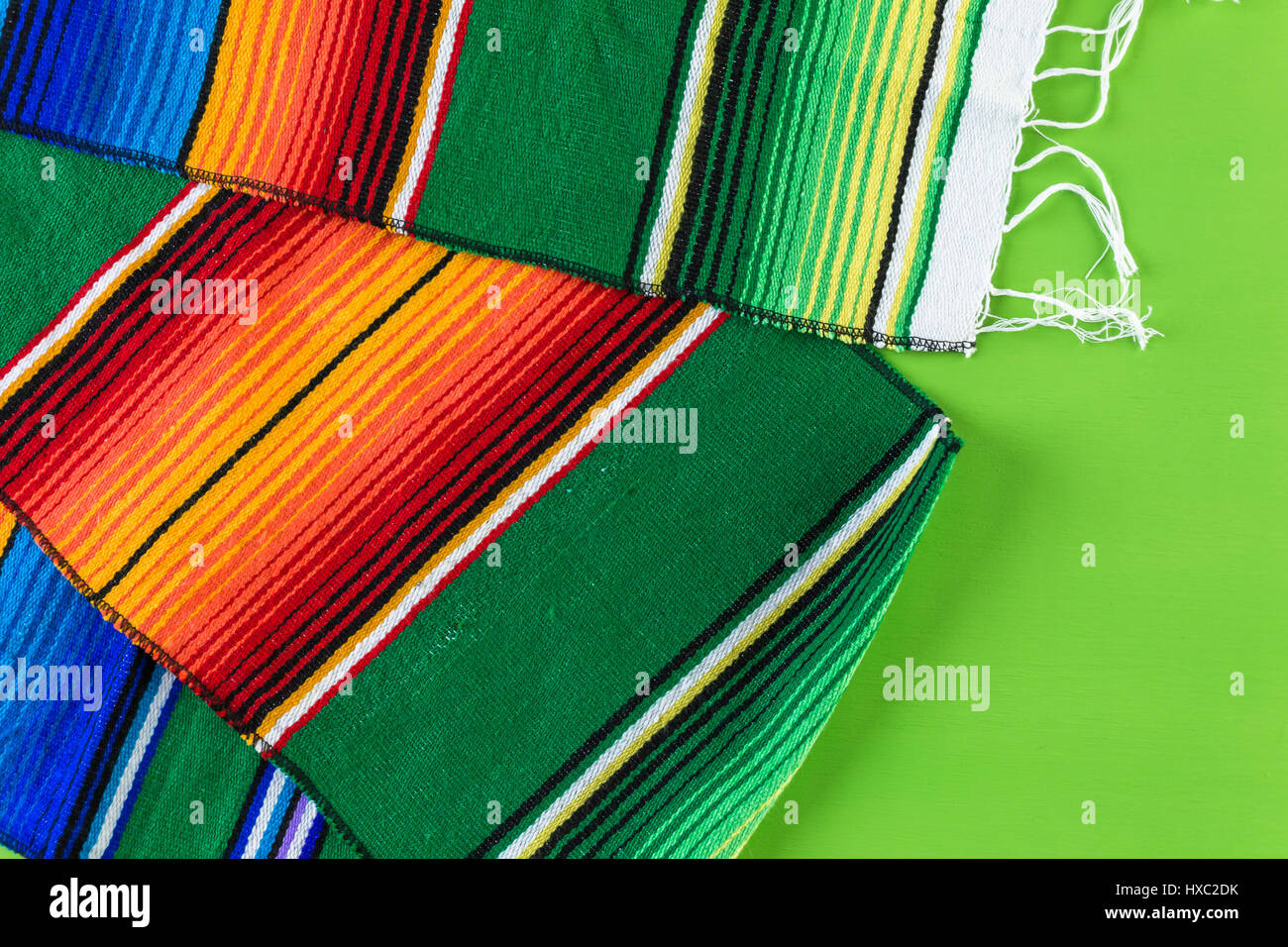 sarape blanket on a bright green background Stock Photo - Alamy