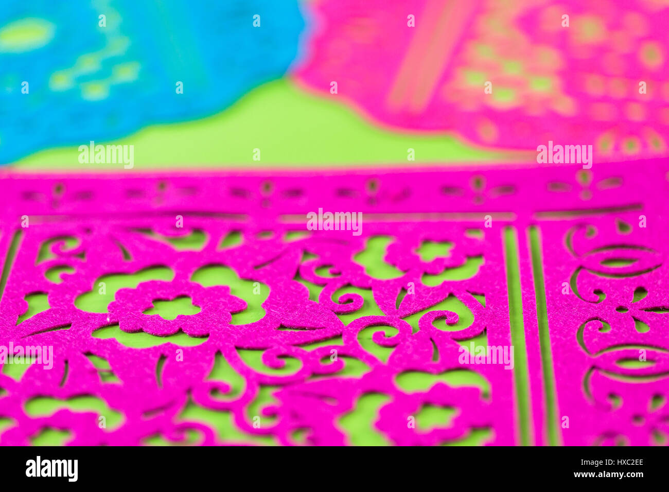 Traditional Mexican papel picado paper banner on a wood background ...