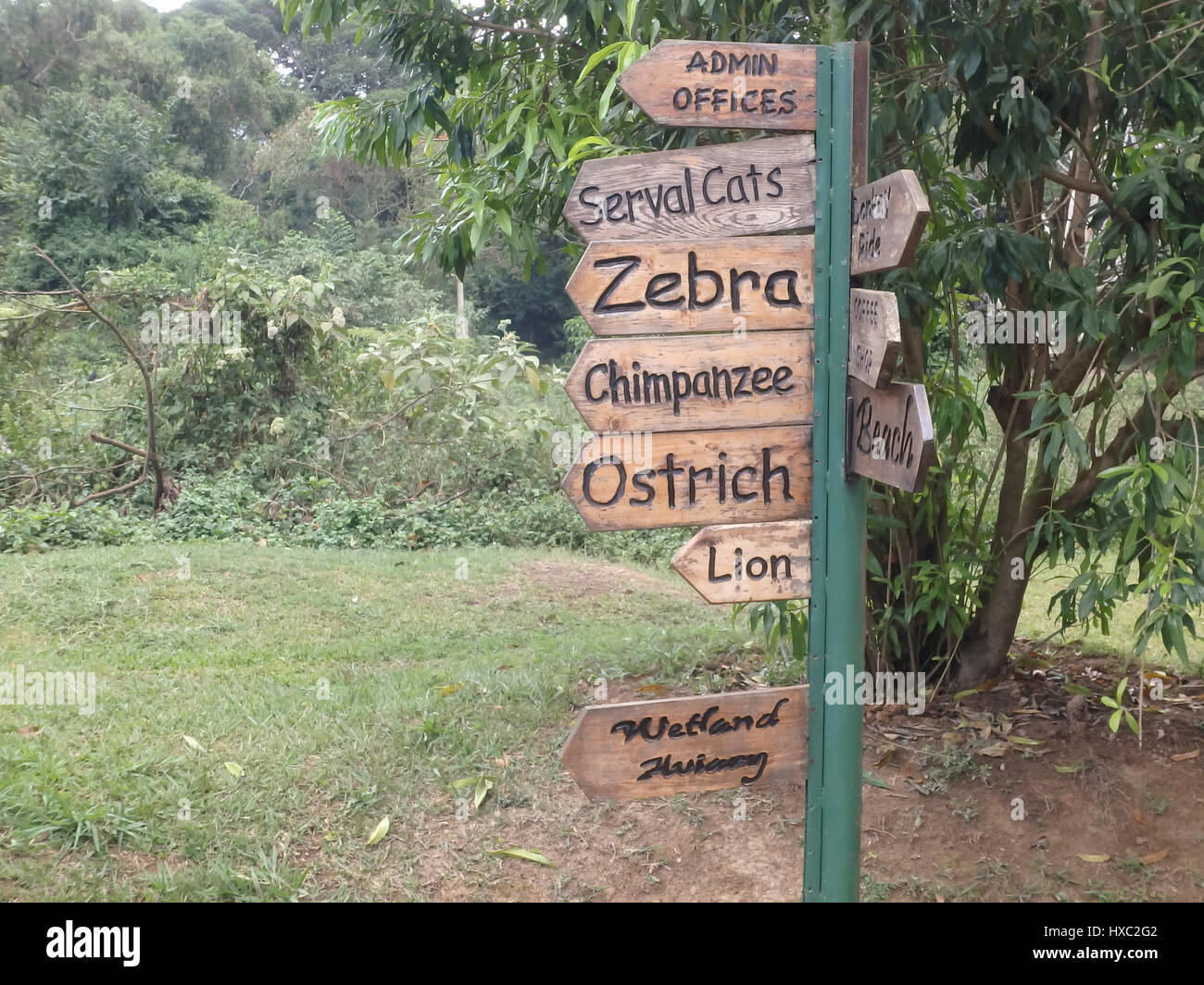 Wooden signs listing African animals on display at zoological park in ...
