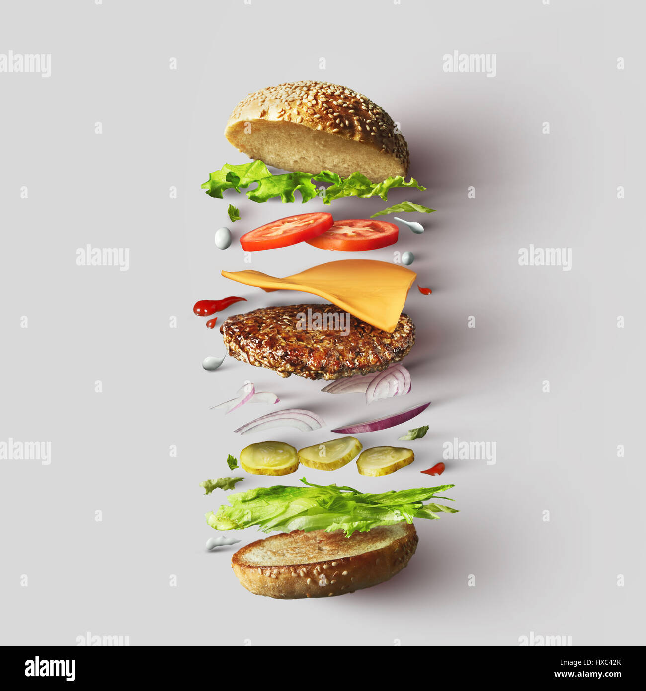 Top view of cheeseburger ingredients represented against white ...