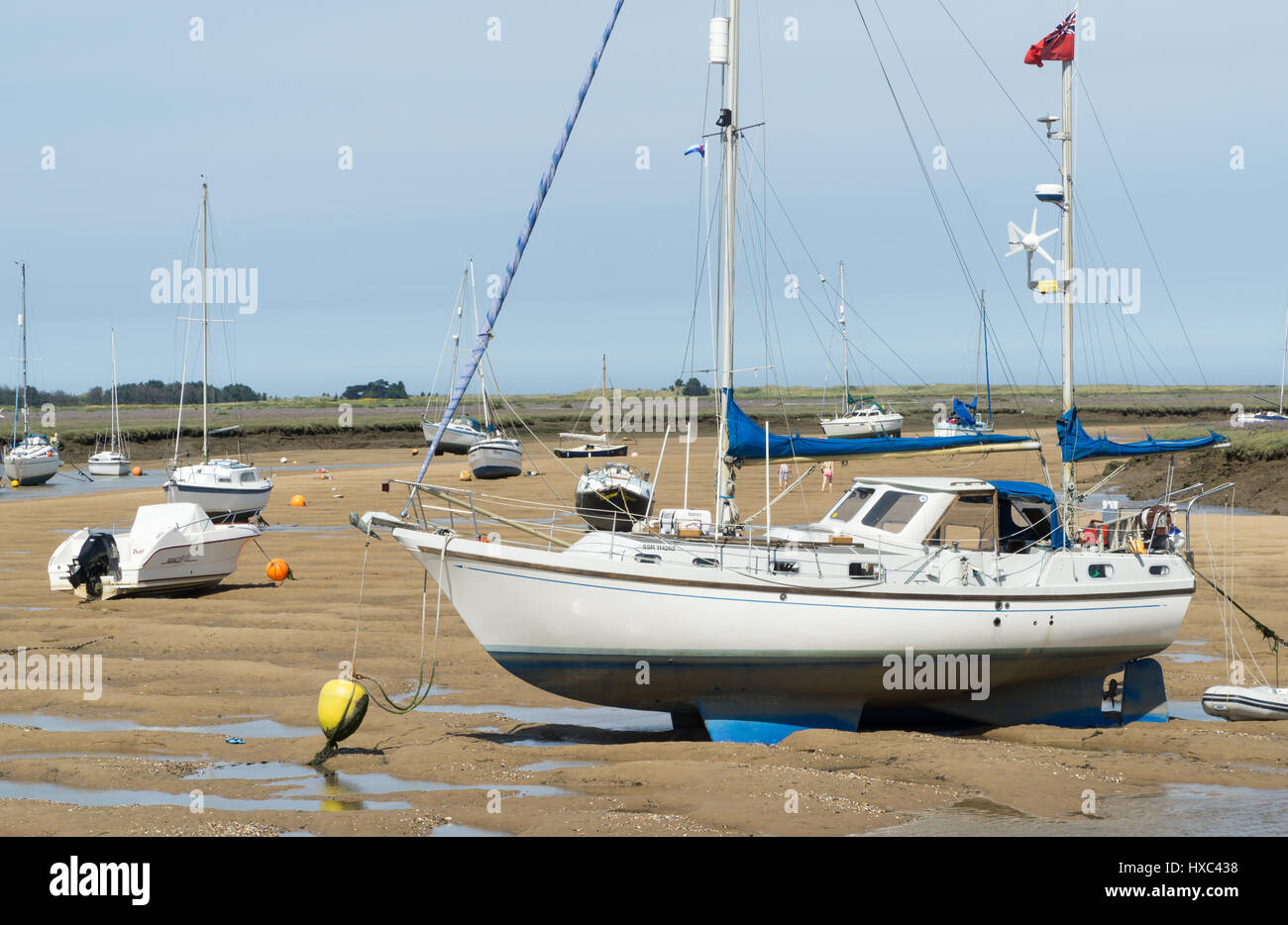 Norfolk coastline a inlet for boats Stock Photo - Alamy