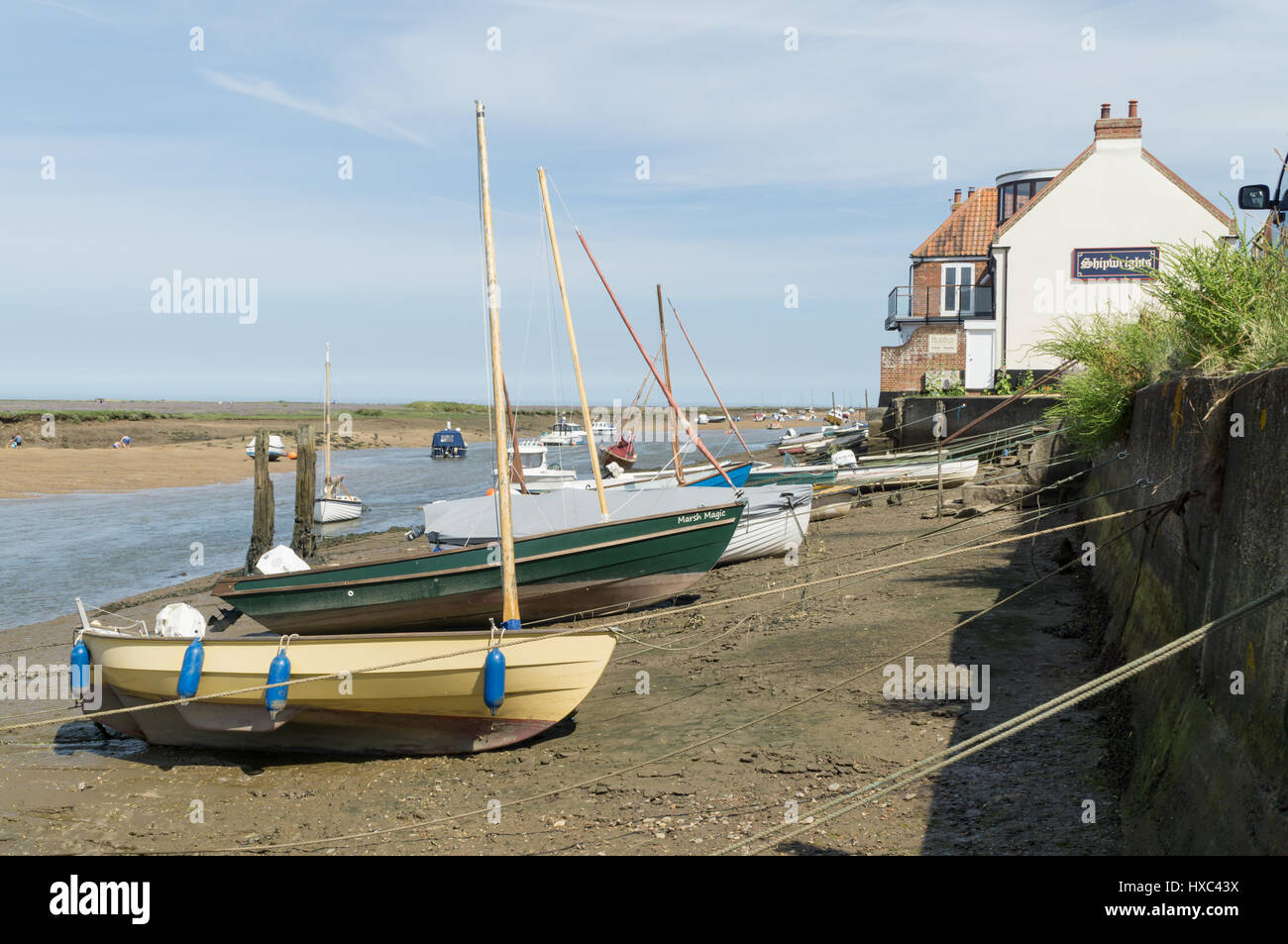 Norfolk coastline a inlet for boats Stock Photo - Alamy