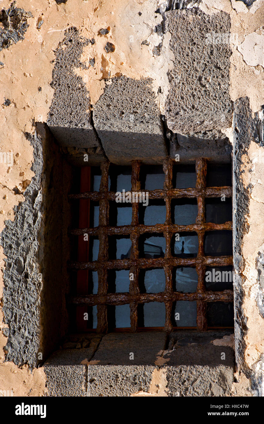 brown distorted castle window in a broke wall arrecife lanzarote spain ...