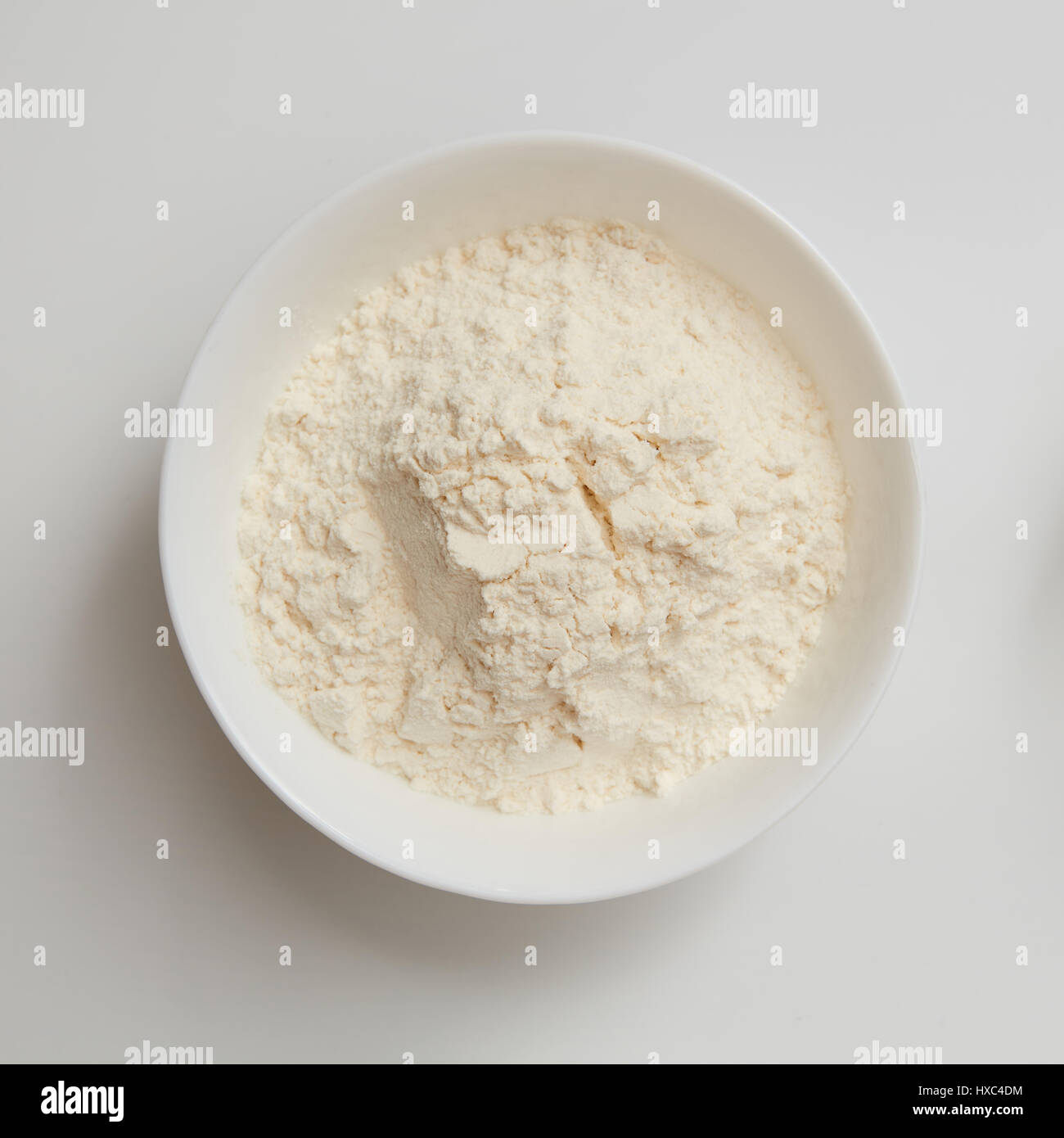 Plate with flour over white background represented in kitchen table ...