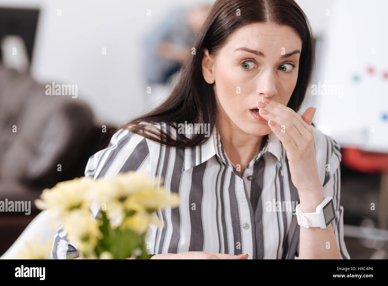 Surprised young woman looking aside Stock Photo - Alamy