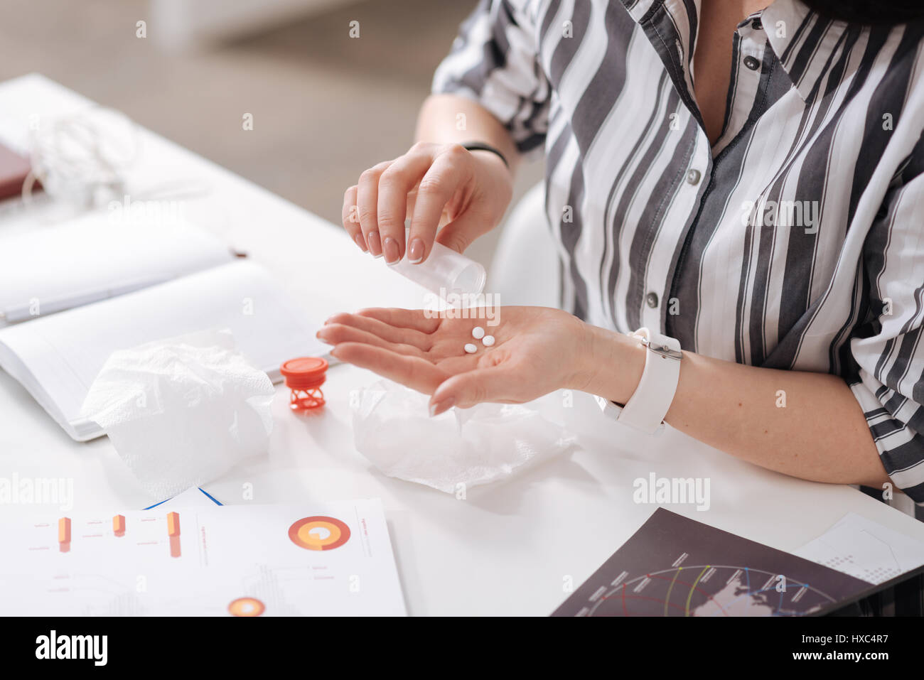 Close up of female hand lying on the workplace Stock Photo - Alamy